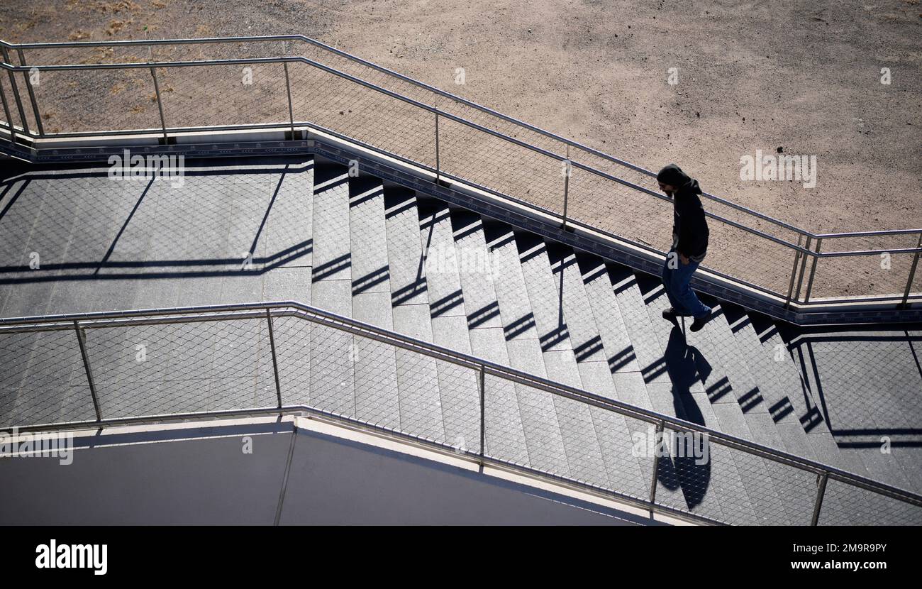 A pedestrian climbs stairs to the U.S. Olympic and Paralympic Museum ...