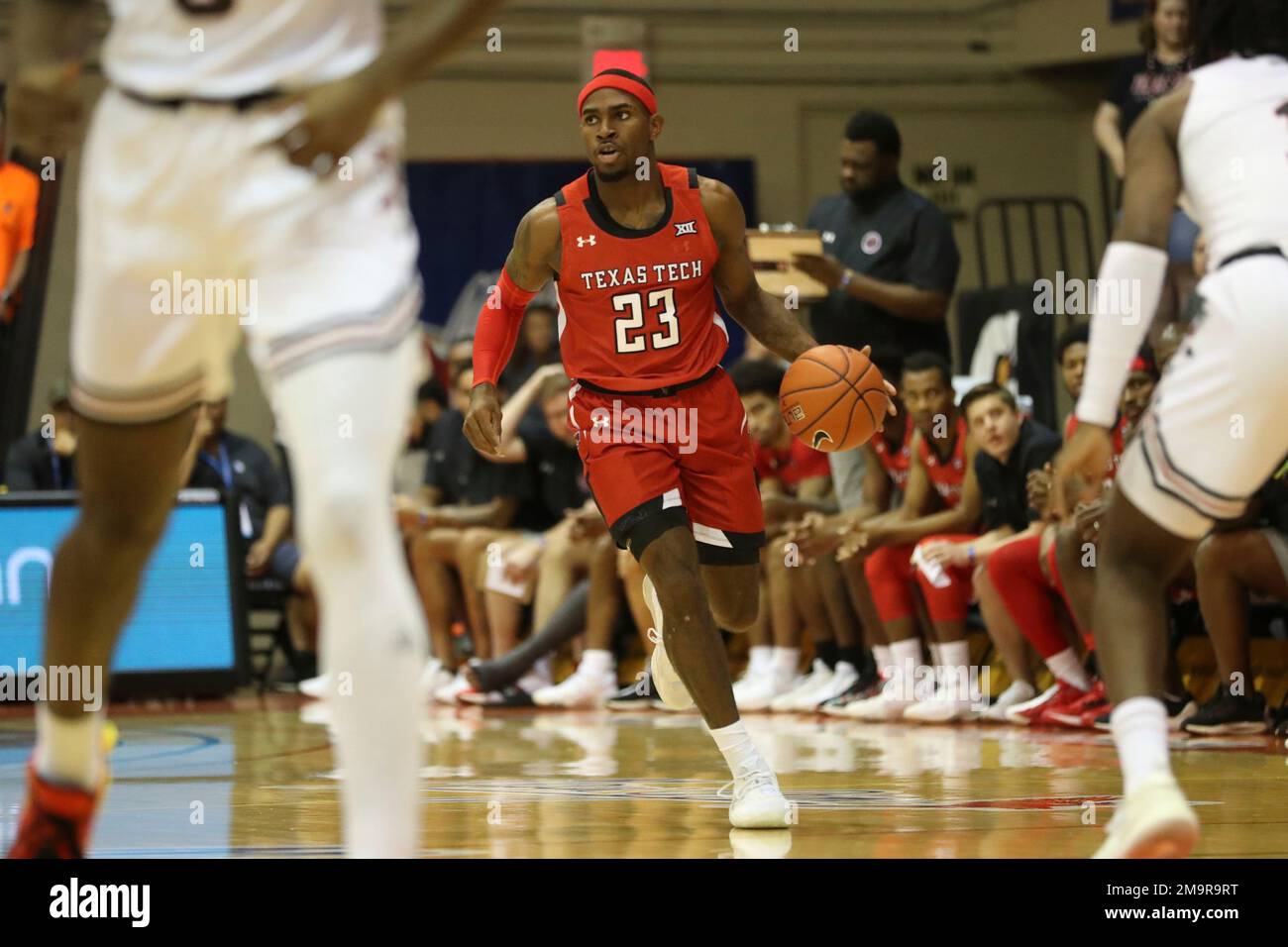 Texas Tech guard De'Vion Harmon (23) looks to get past the Louisville ...