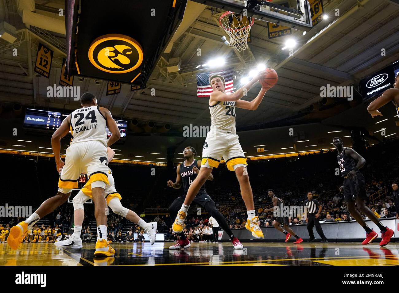 Iowa forward Payton Sandfort (20) grabs a rebound during the first half ...