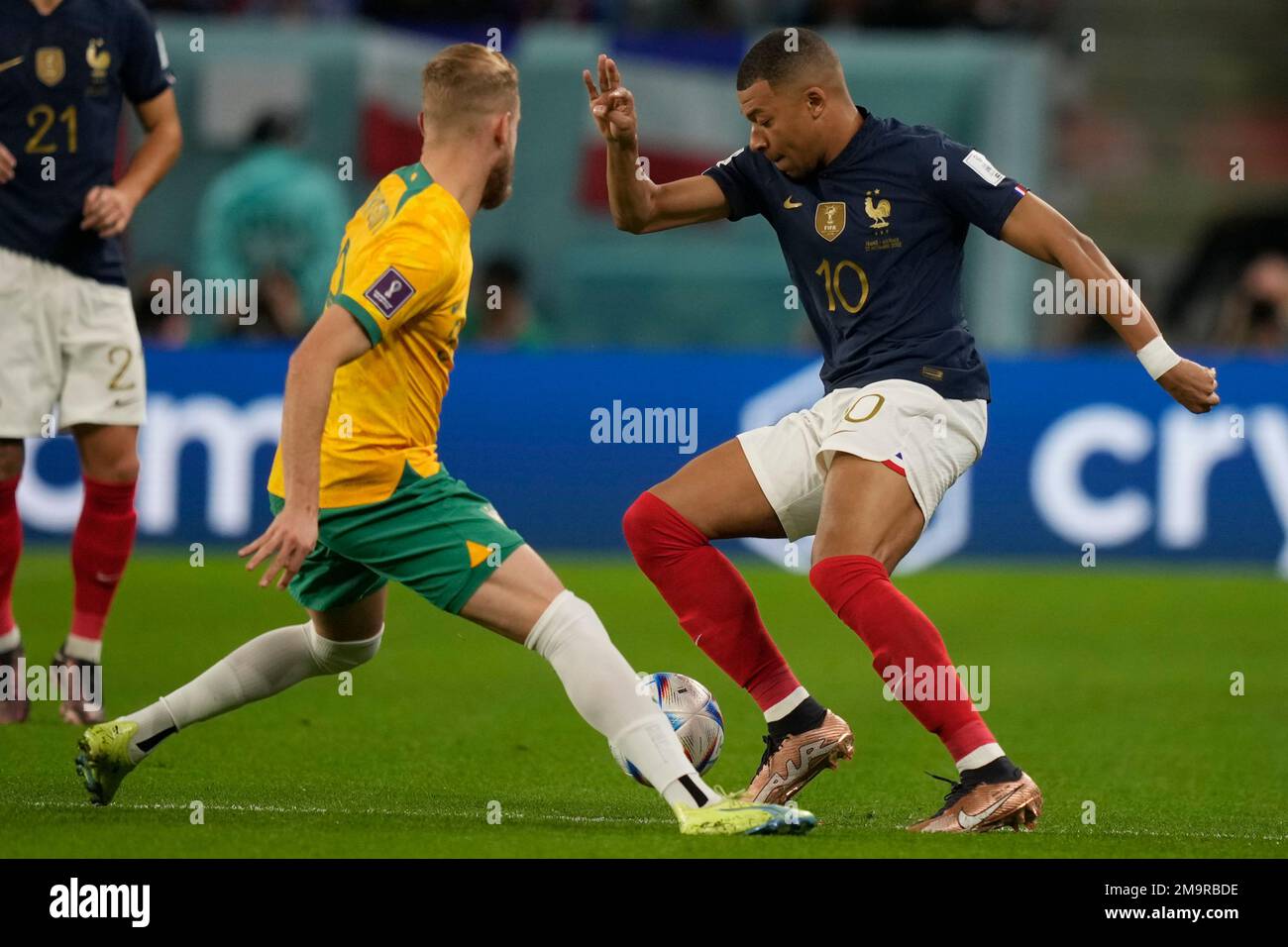 France's Kylian Mbappe in action in front of Australia's Nathaniel ...