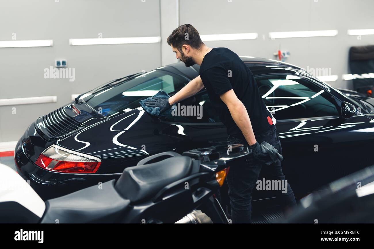 Ceramic coating. Car detailing process. Adult man applying specialistic ...