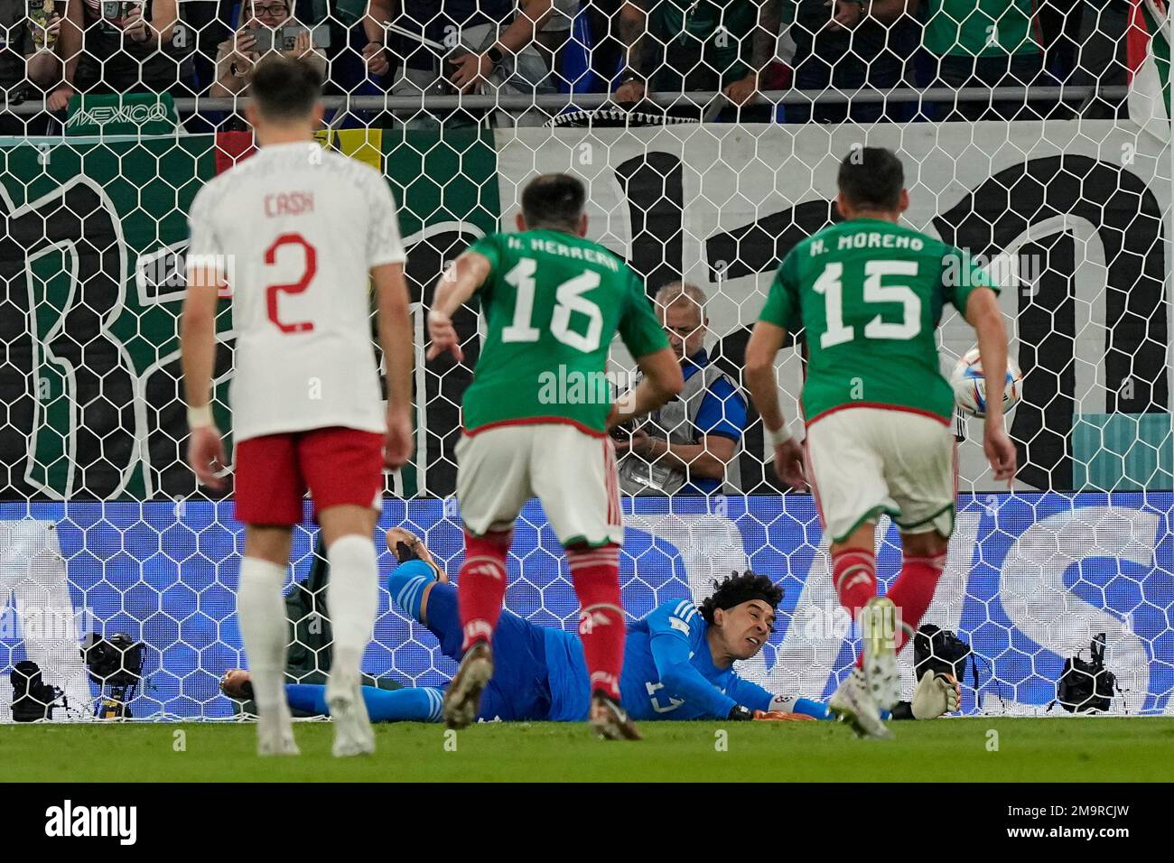 Mexico's goalkeeper Guillermo Ochoa blocks a penalty shot from Poland's ...
