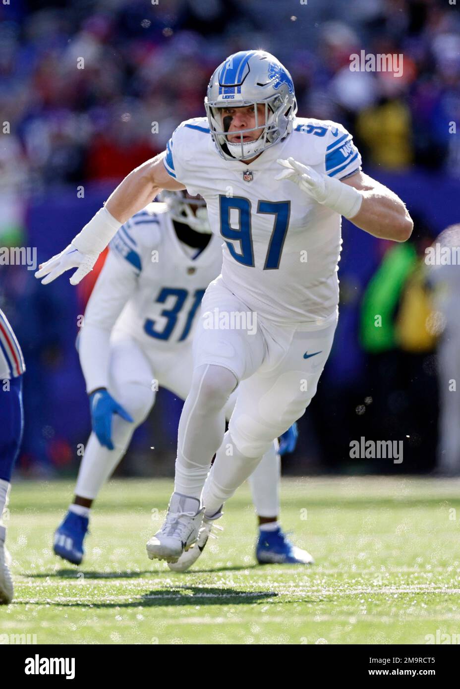 Detroit Lions defensive end Aidan Hutchinson (97) defends New York ...