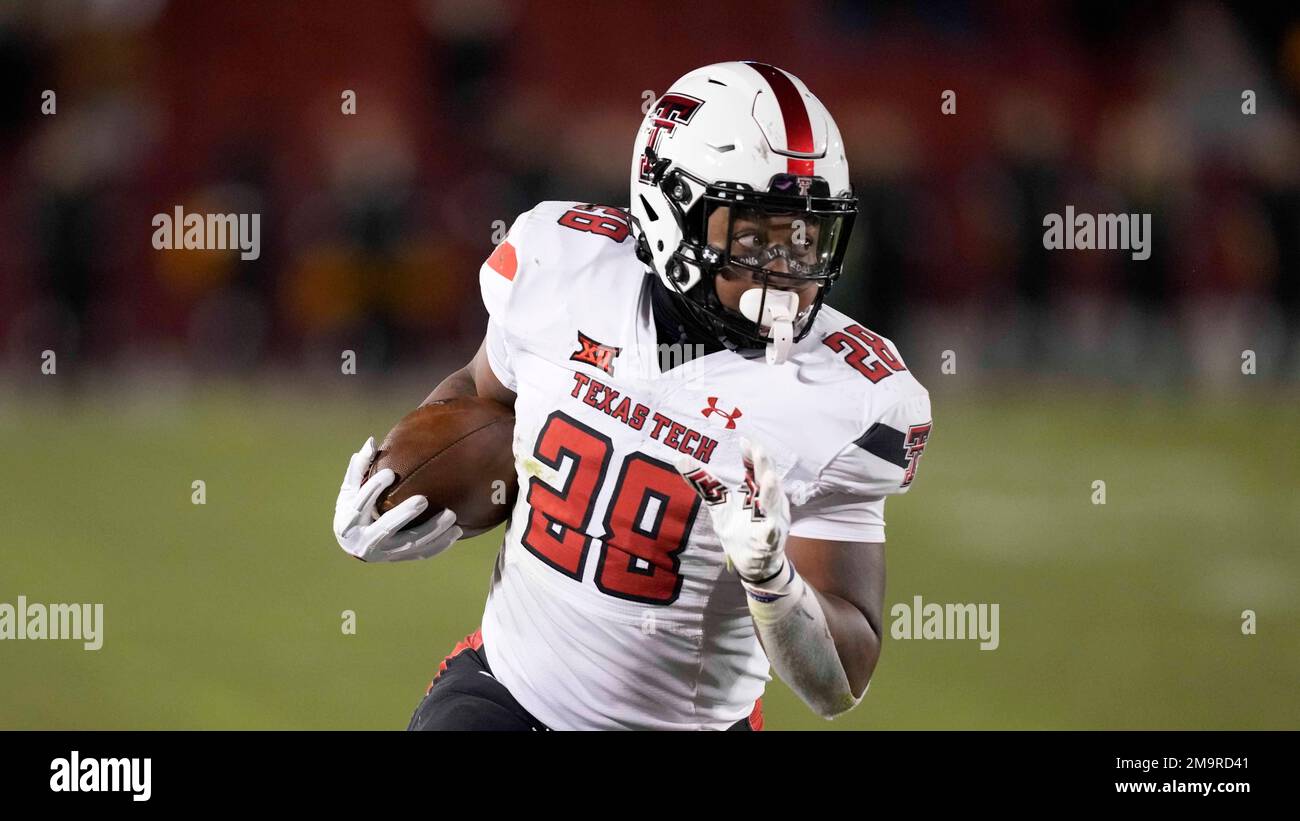 Texas Tech running back Tahj Brooks carries the ball up field during an ...