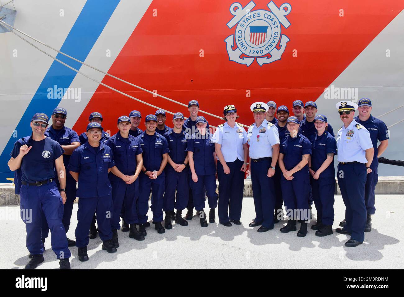 U.S. Coast Guard Cutter Munro crew pose in front of the cutter ...