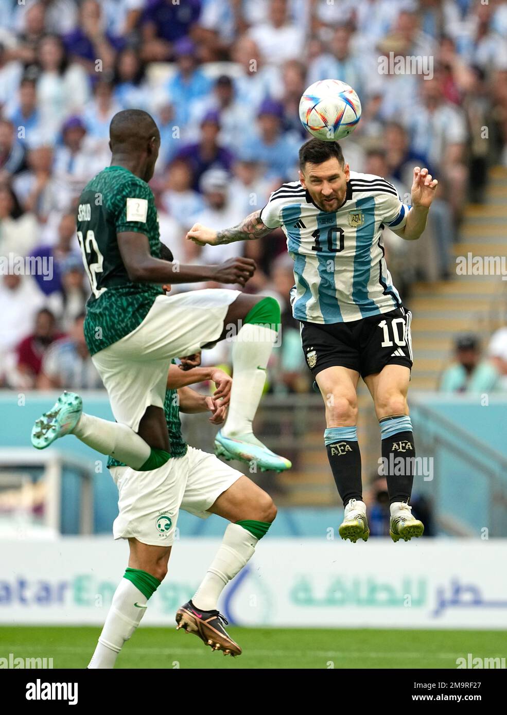 Argentina's Lionel Messi, right, and Saudi Arabia's Saud Abdulhamid ...