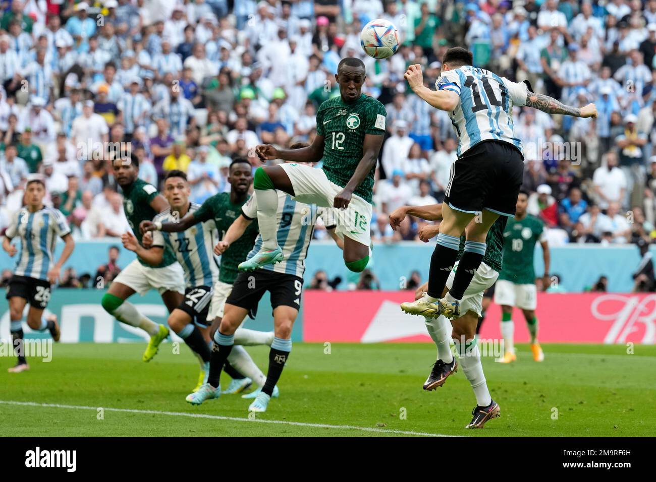 Saudi Arabia's Saud Abdulhamid defending a head ball from Argentina's ...