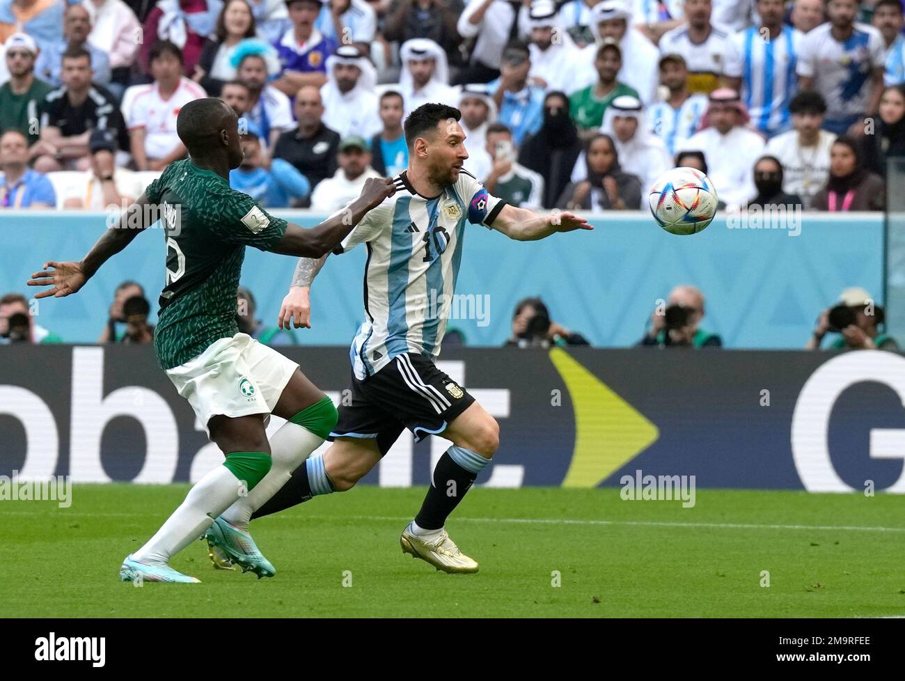 Argentina's Lionel Messi, right, duels for the ball with Saudi Arabia's ...