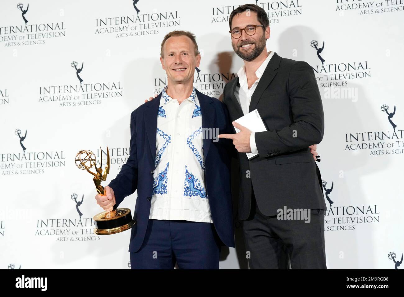 Marc Munden, left, and Ryan Eggold appear in the press room at the 50th ...