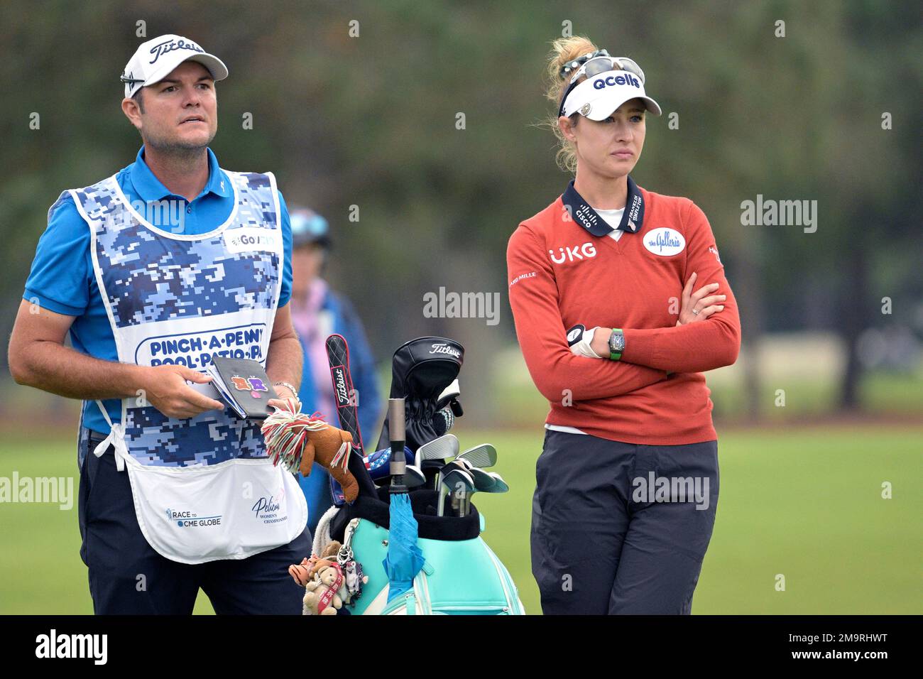 Nelly Korda, right, waits to hit from the 18th fairway as her caddie ...