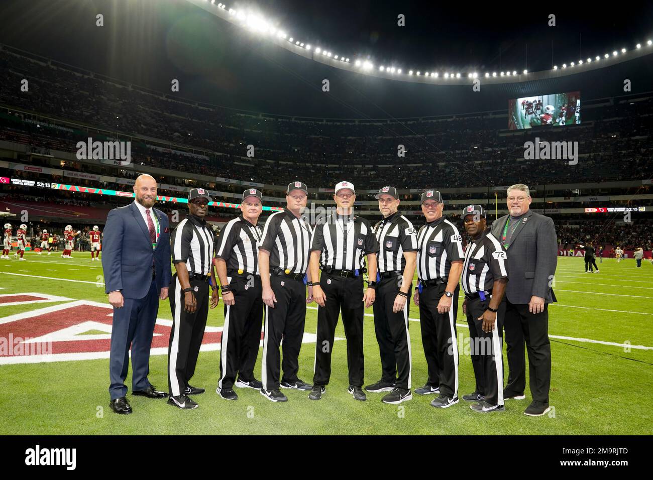 The referee crew poses before an NFL football game between the Arizona ...