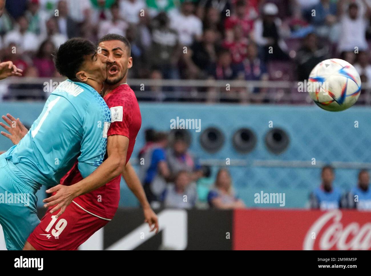 Iran's goalkeeper Alireza Beiranvand collides with Iran's Majid ...