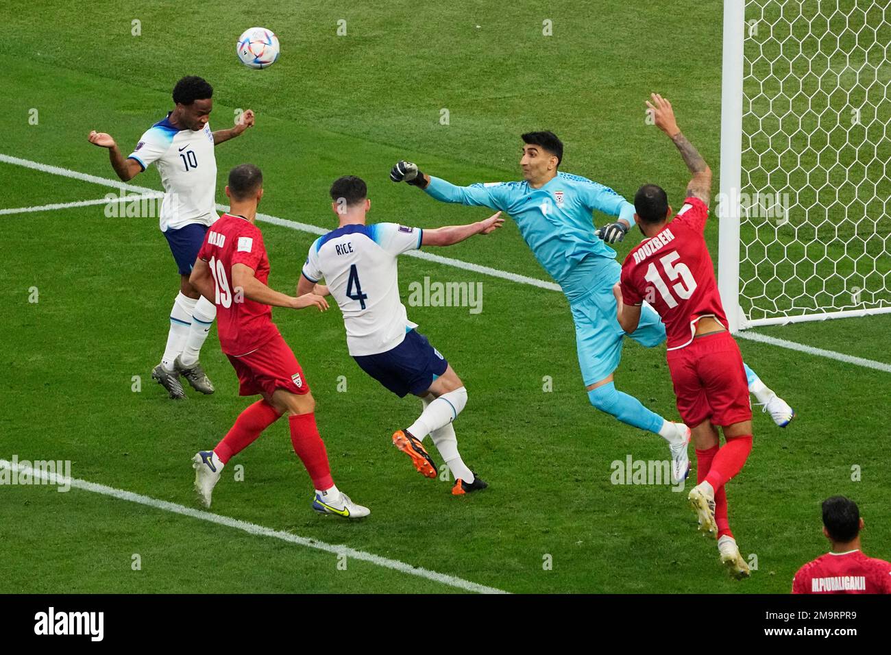 Iran's goalkeeper Alireza Beiranvand, second from right, clears the ...