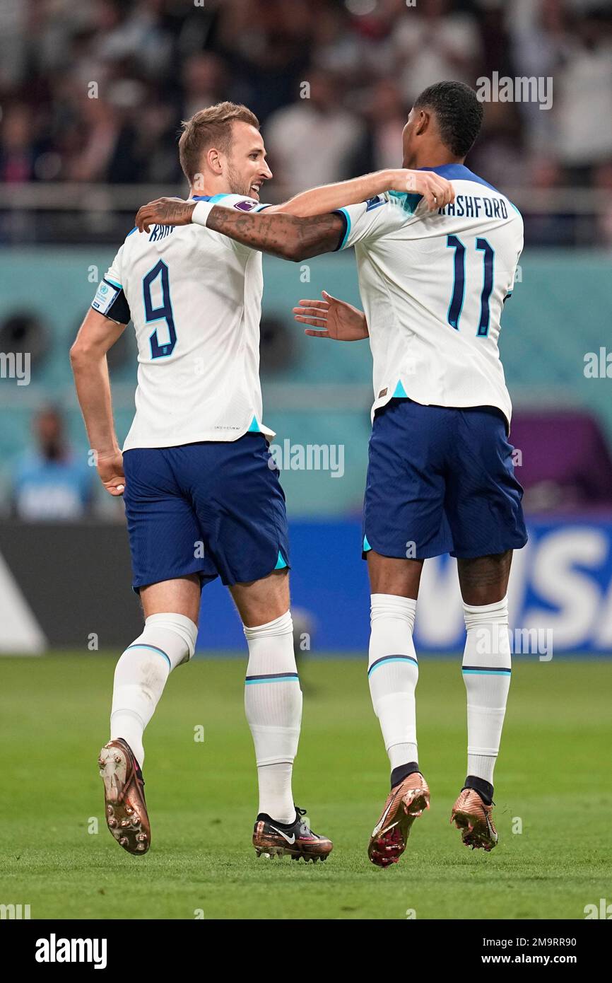 England's Marcus Rashford, right, celebrates with teammate Harry Kane ...