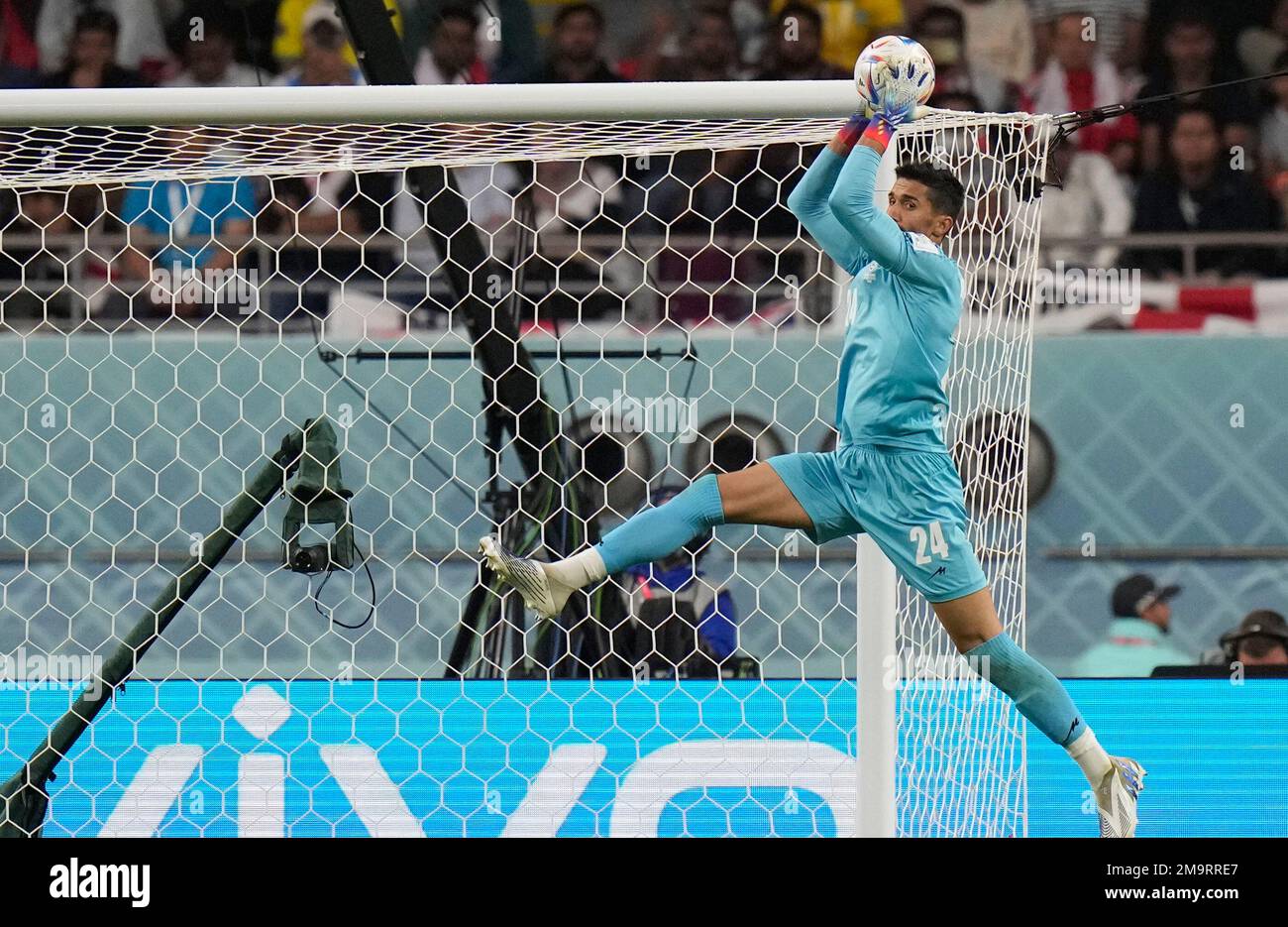 Iran's goalkeeper Abolfazl Jalali makes a save during the World Cup ...