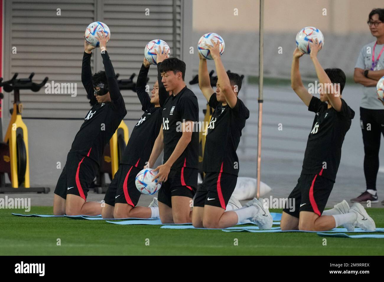 South Korea's Son Heung-min, left, warms up with his teammates during a ...