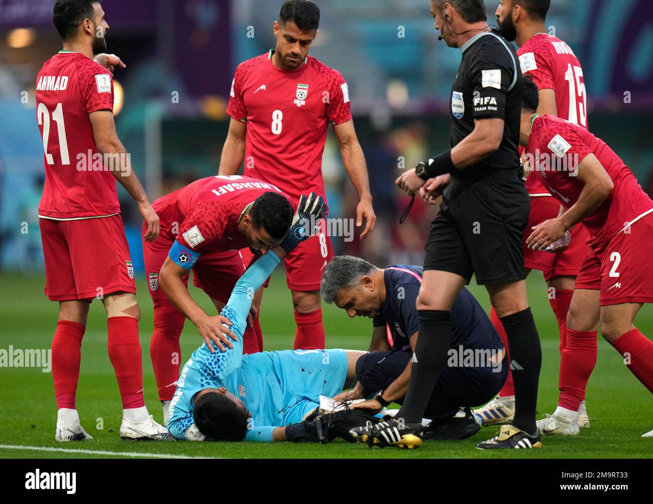 Iran's goalkeeper Alireza Beiranvand gets treatment after an injury ...