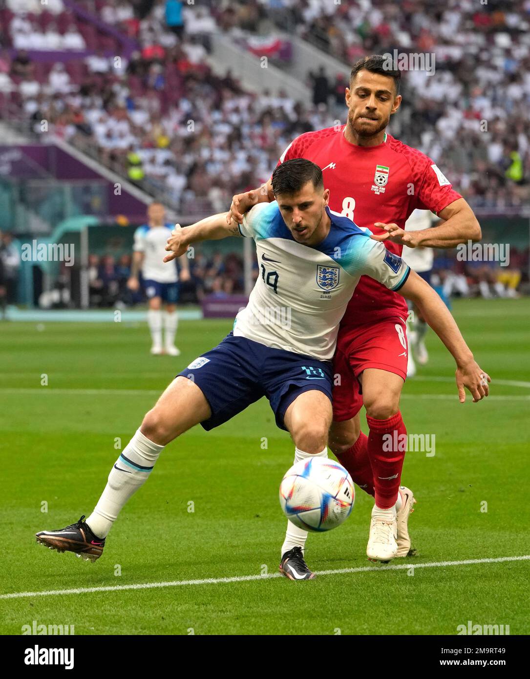 Iran's Morteza Pouraliganji, right, challenges for the ball with ...