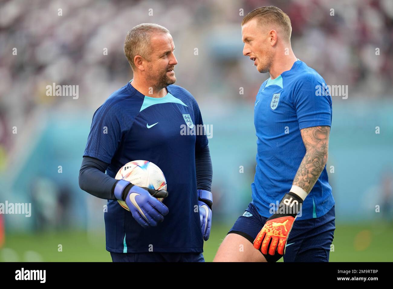 England goalkeeper coach Martin Margetson, left, interacts with ...
