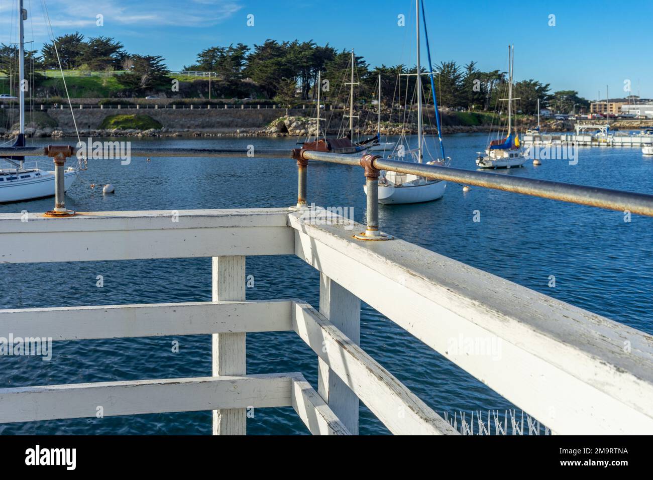 White wooden railing with galvanized steel pipe on a pier Stock Photo ...