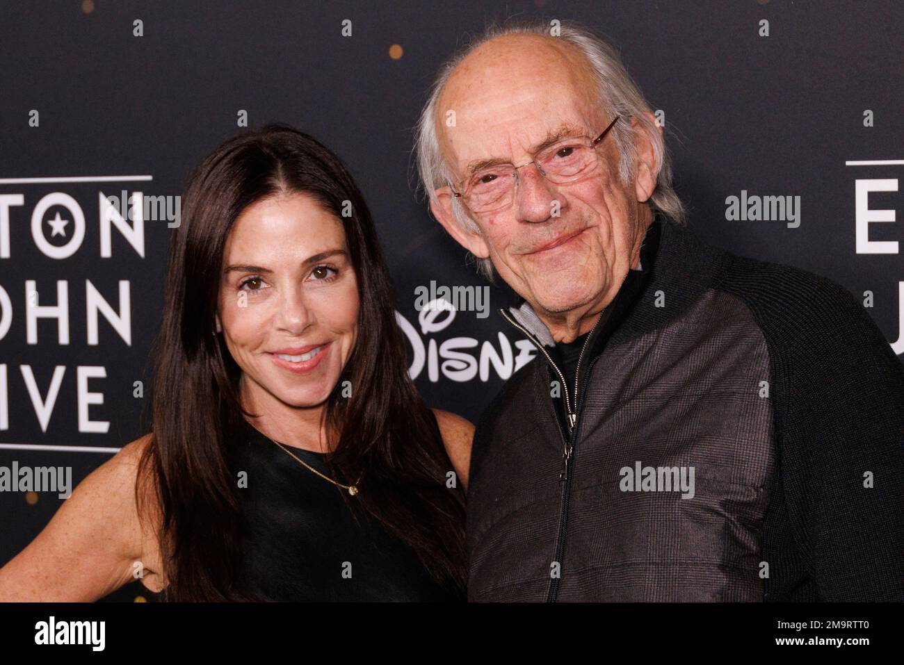 Lisa Loiacono, left and Cristopher Lloyd arrive at the Elton John's ...