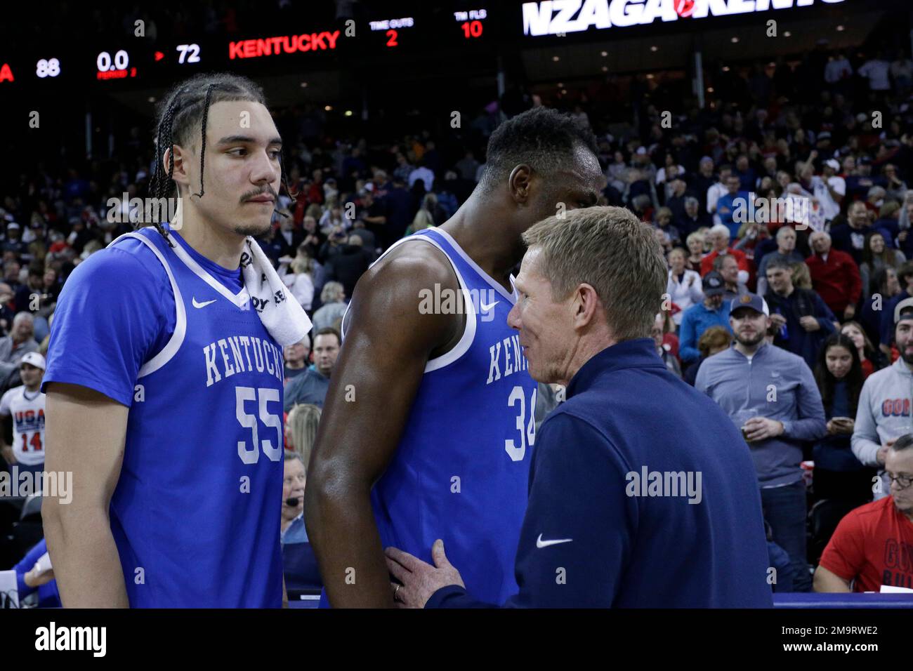 Gonzaga head coach Mark Few, right, speaks with Kentucky forward Oscar ...