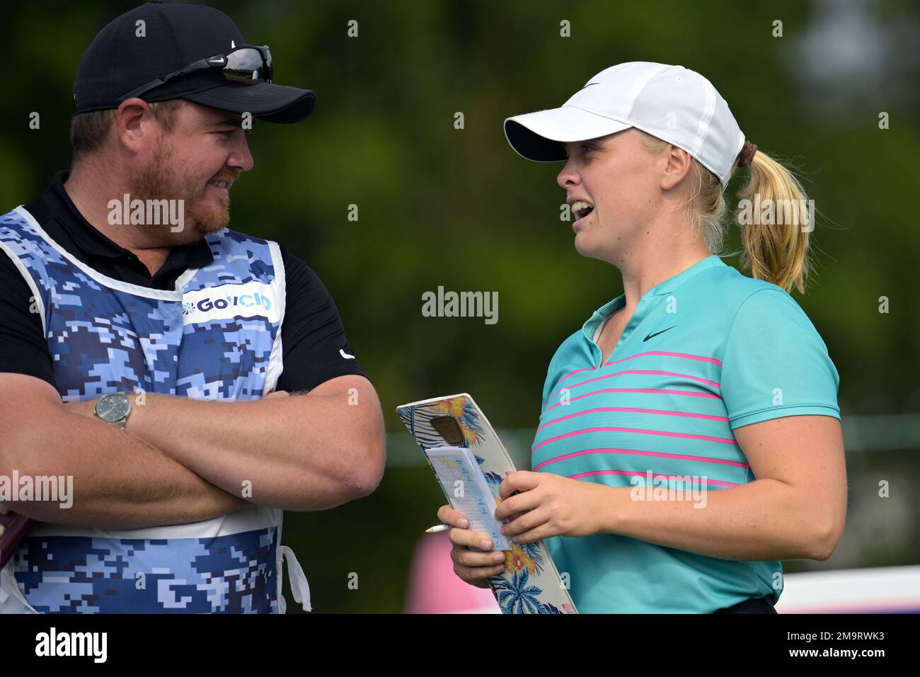 Maja Stark, right, of Sweden, shares a laugh with her caddie while ...