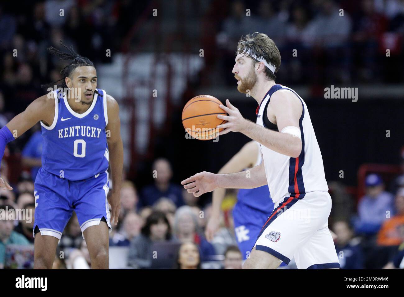 Gonzaga forward Drew Timme, right, controls the ball while defended by ...
