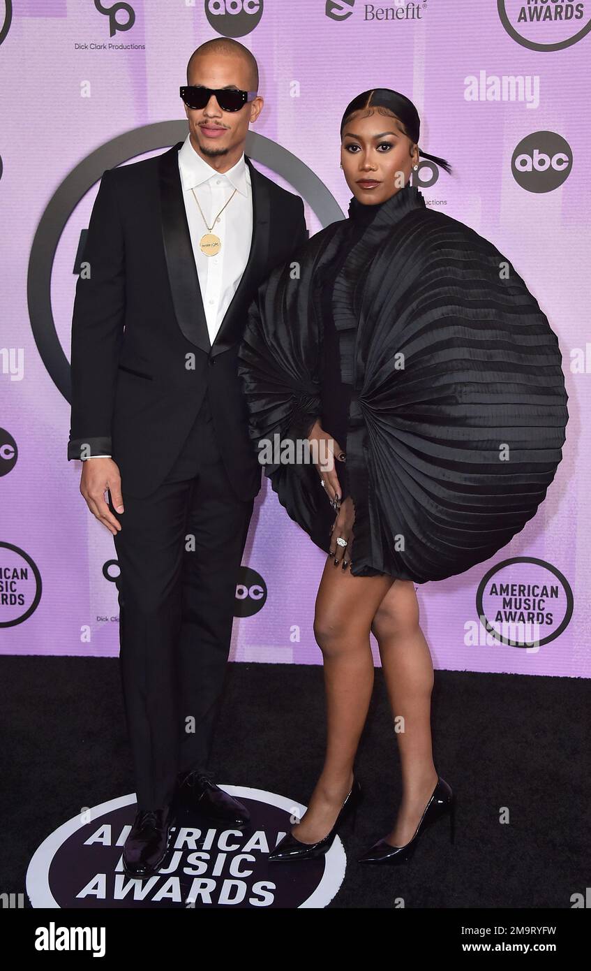 Raysean Hairston, left, and Muni Long arrives at the American Music ...