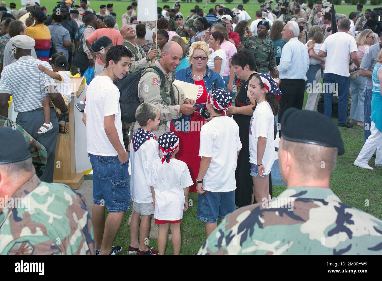 030822-A-0405B-025. US Army (USA) Soldiers are reunited with family ...
