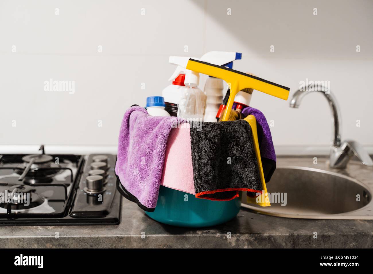 Bucket with detergent and microfiber rags for house cleaning ...
