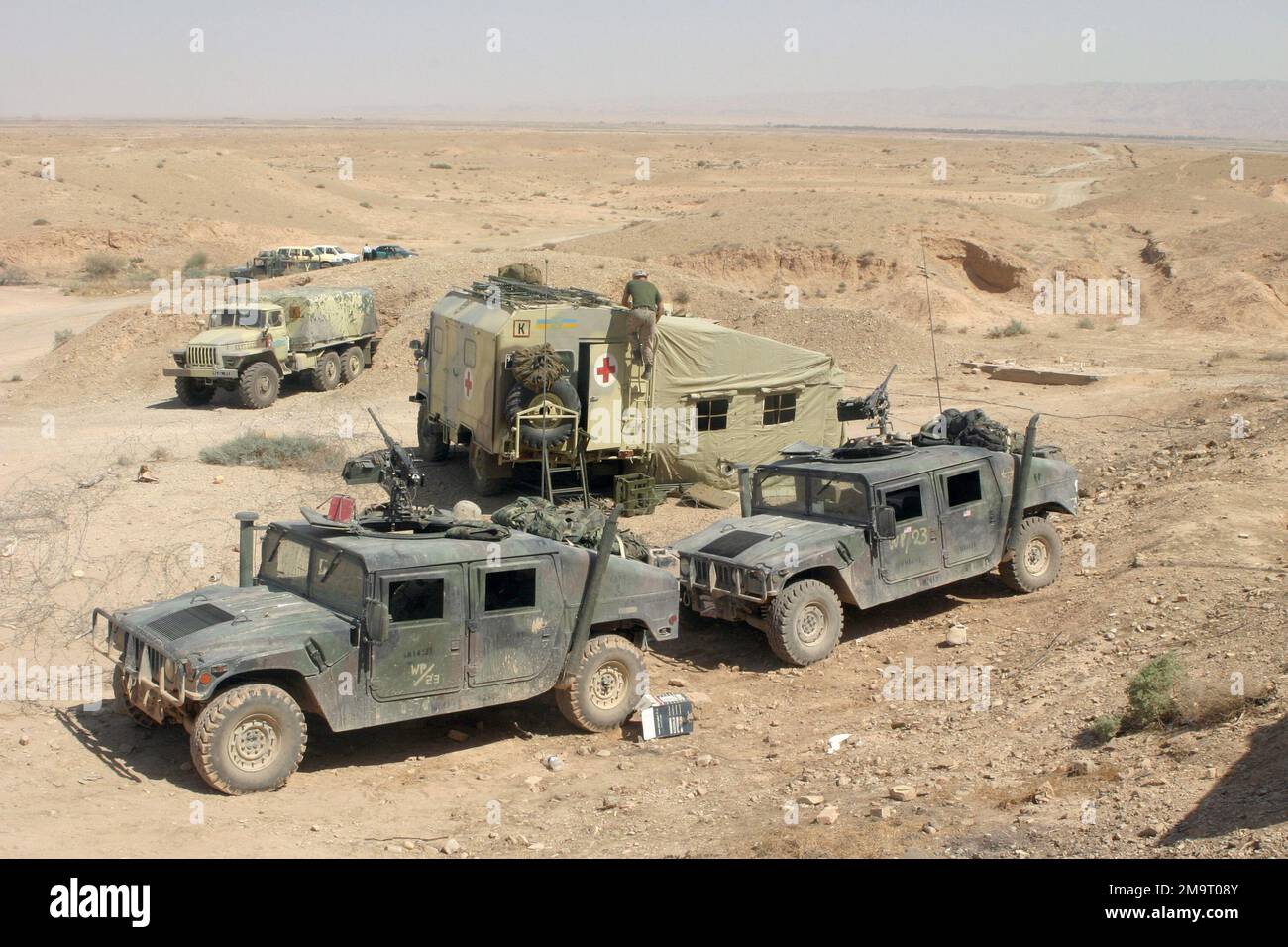 Two US Marine Corps (USMC) High-Mobility Multipurpose Wheeled Vehicles ...