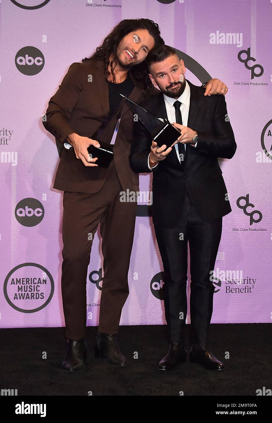 Dan Smyers, left, and Shay Mooney of Dan + Shay pose in the press room ...