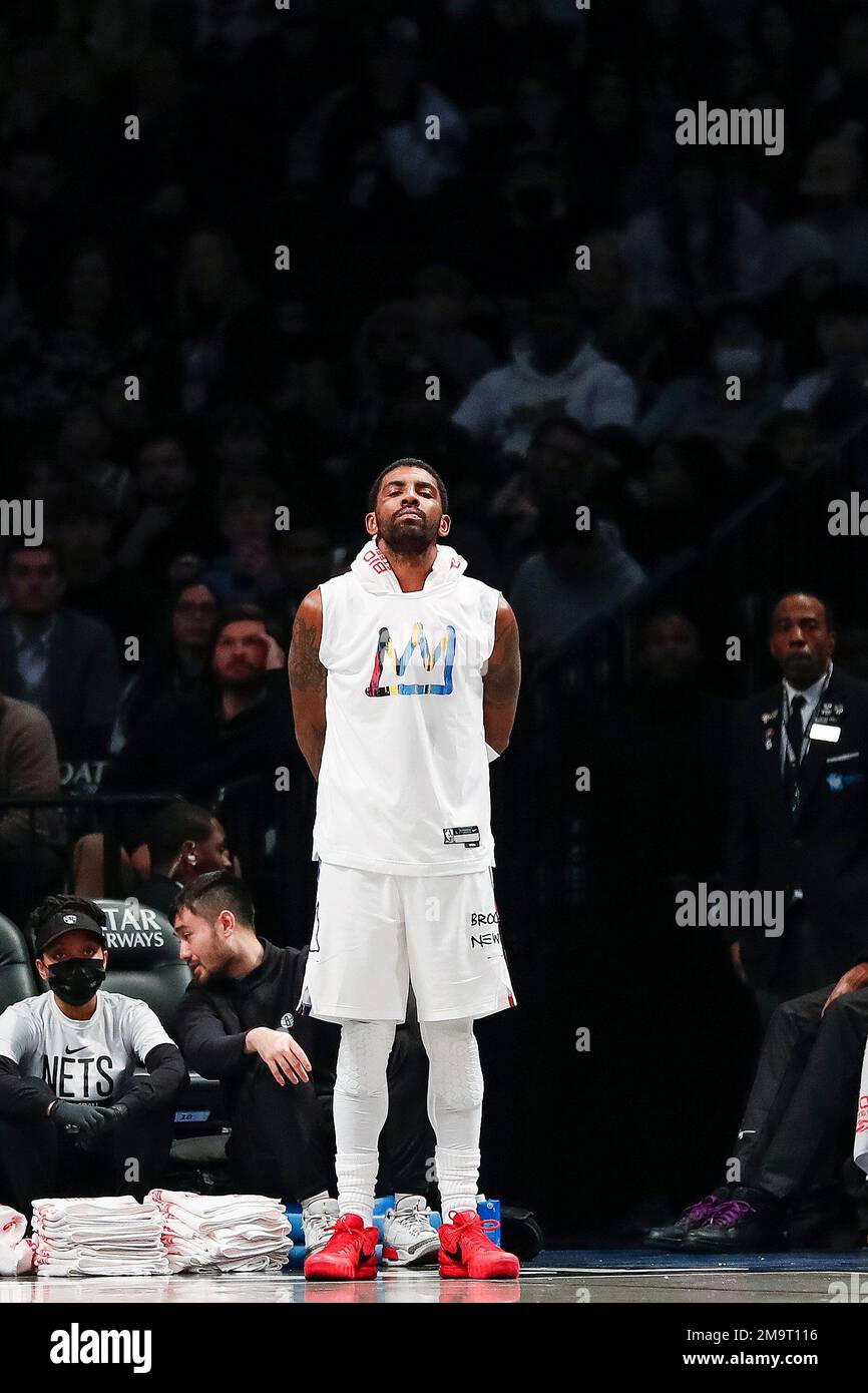 Brooklyn Nets guard Kyrie Irving watches from the bench during the ...