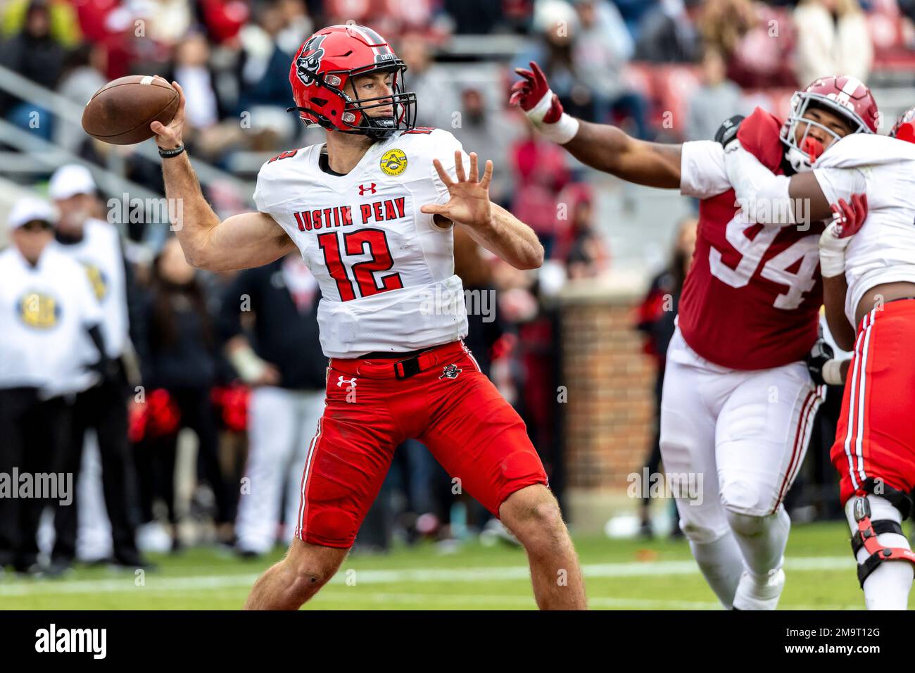 Austin Peay quarterback Mike DiLiello (12) throws the ball under ...