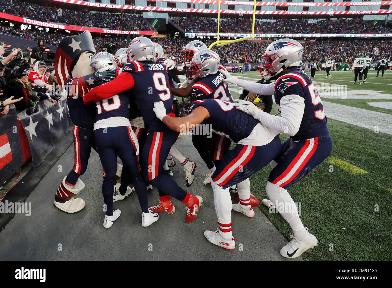 The New England Patriots celebrate the touchdown punt return by ...