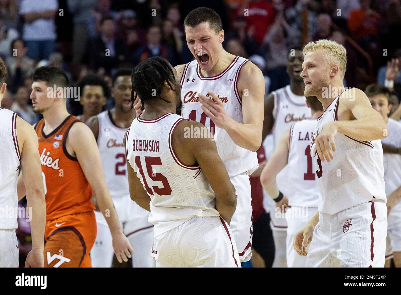 College of Charleston's Pat Robinson III (15) is celebrated by teammate ...