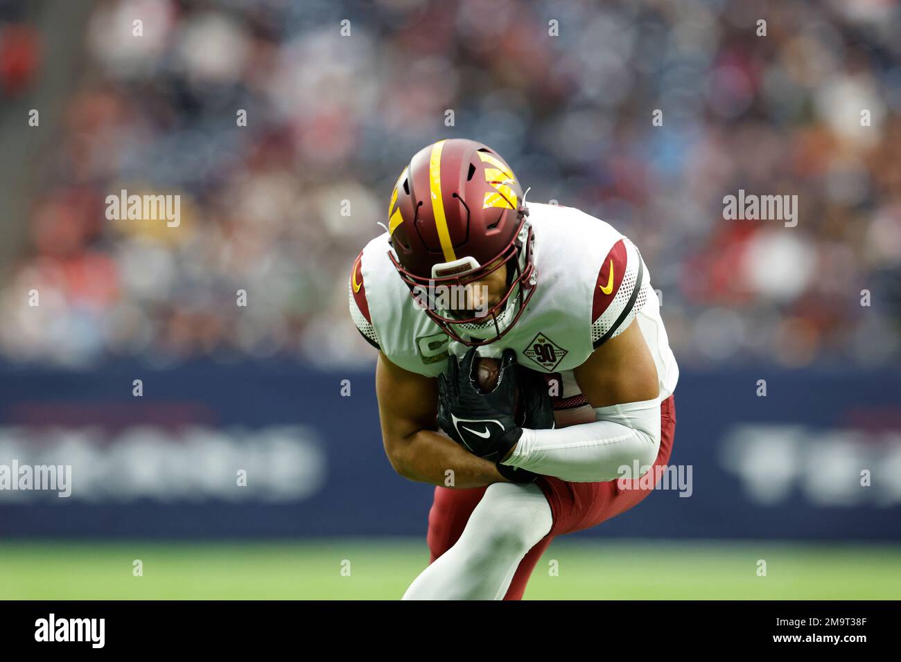 Washington Commanders tight end Logan Thomas (82) carries the ball ...