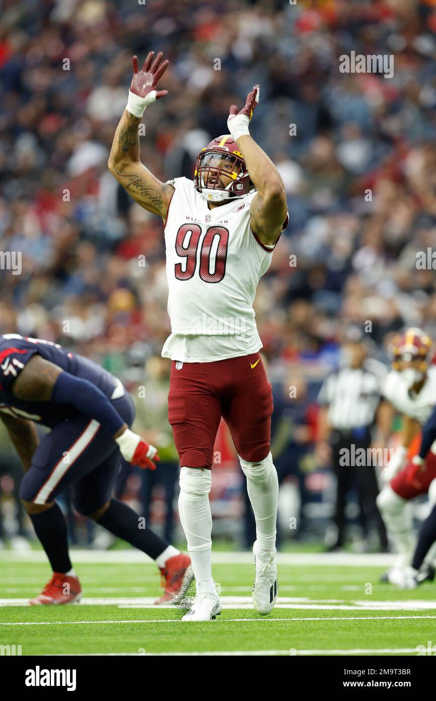Washington Commanders defensive end Montez Sweat (90) jumps to defend a ...