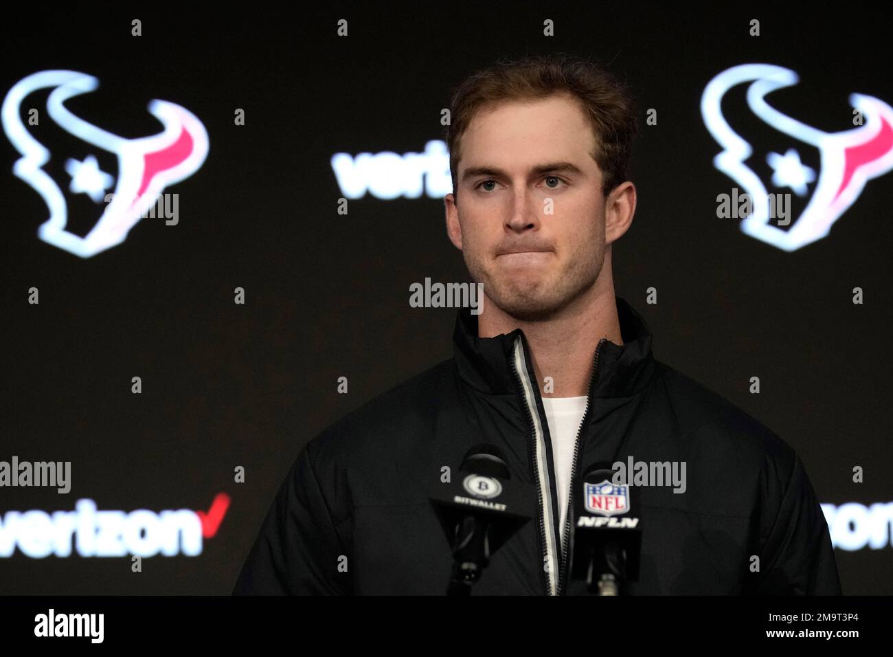 Houston Texans quarterback Davis Mills listens to a question after an ...
