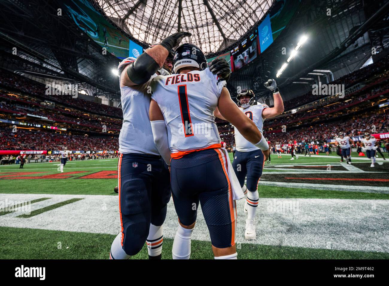 Chicago Bears quarterback Justin Fields (1) celebrates a touchdown with ...