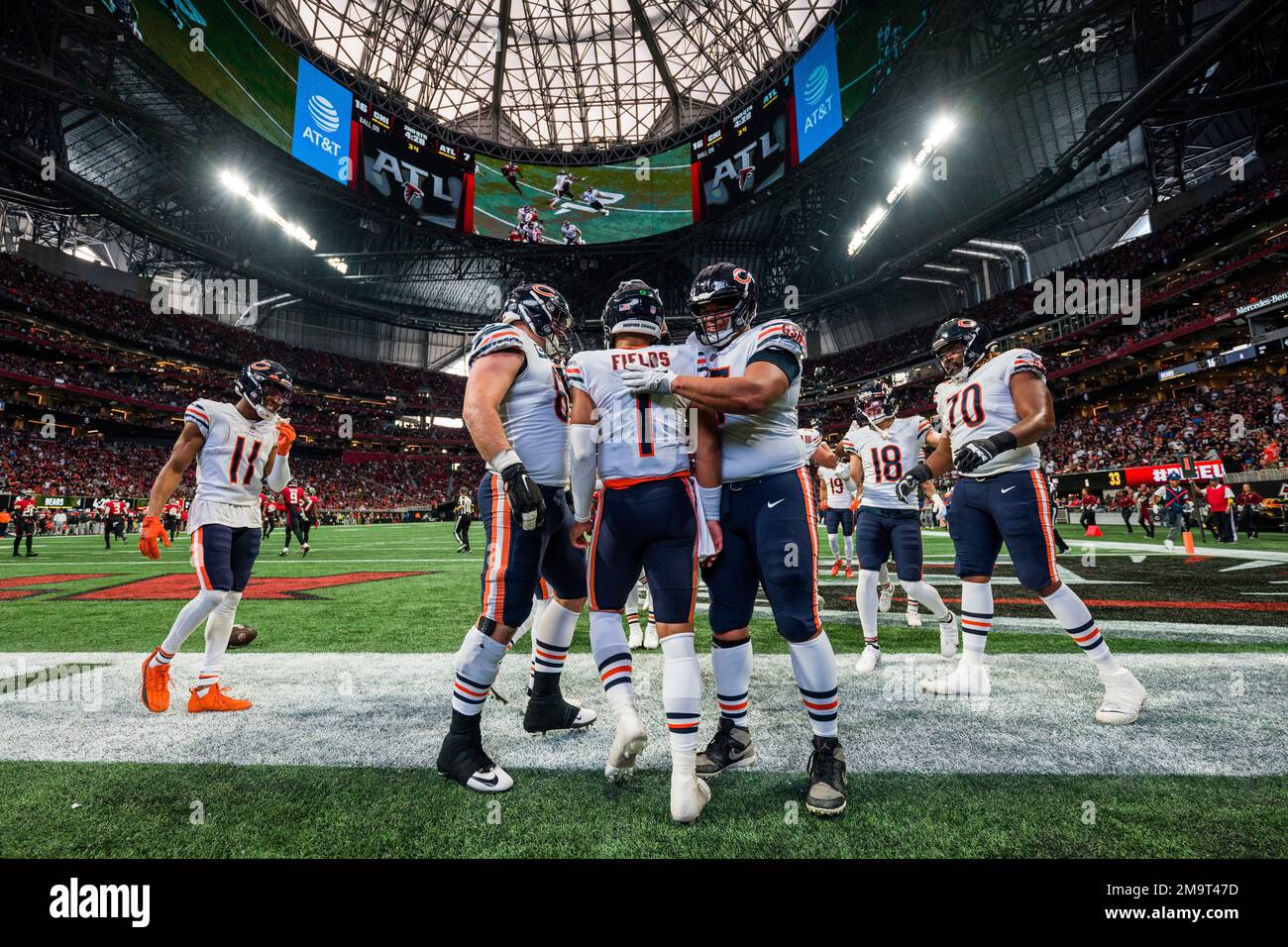 Chicago Bears quarterback Justin Fields (1) celebrates a touchdown with ...
