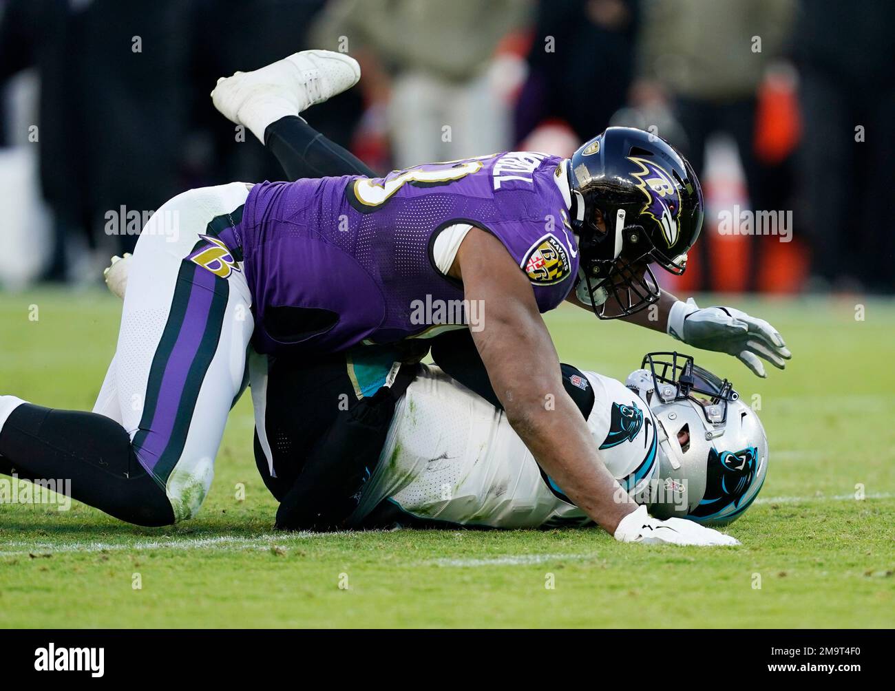 Baltimore Ravens defensive tackle Calais Campbell (93) sucks Carolina ...