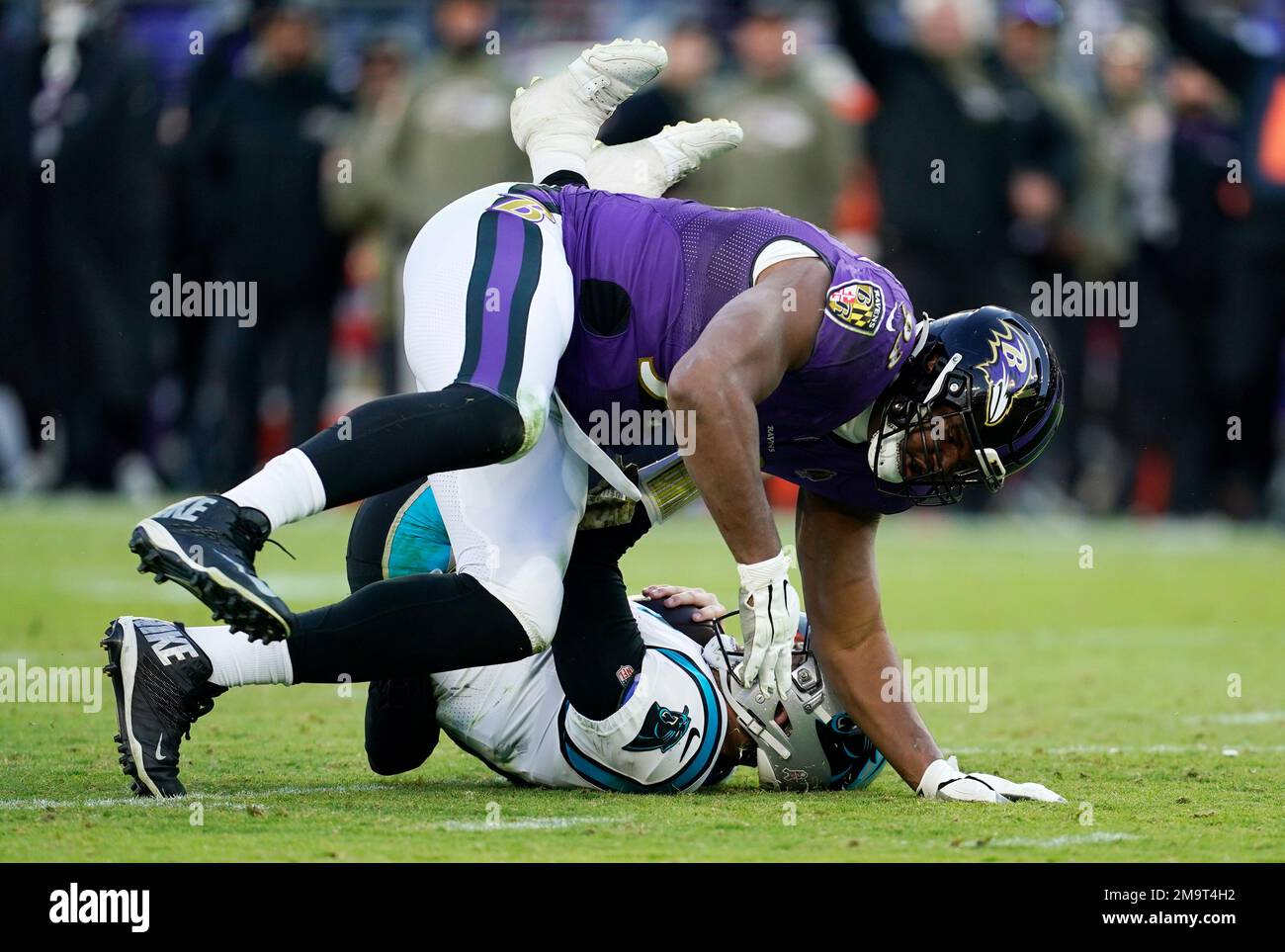 Baltimore Ravens defensive tackle Calais Campbell (93) sucks Carolina ...