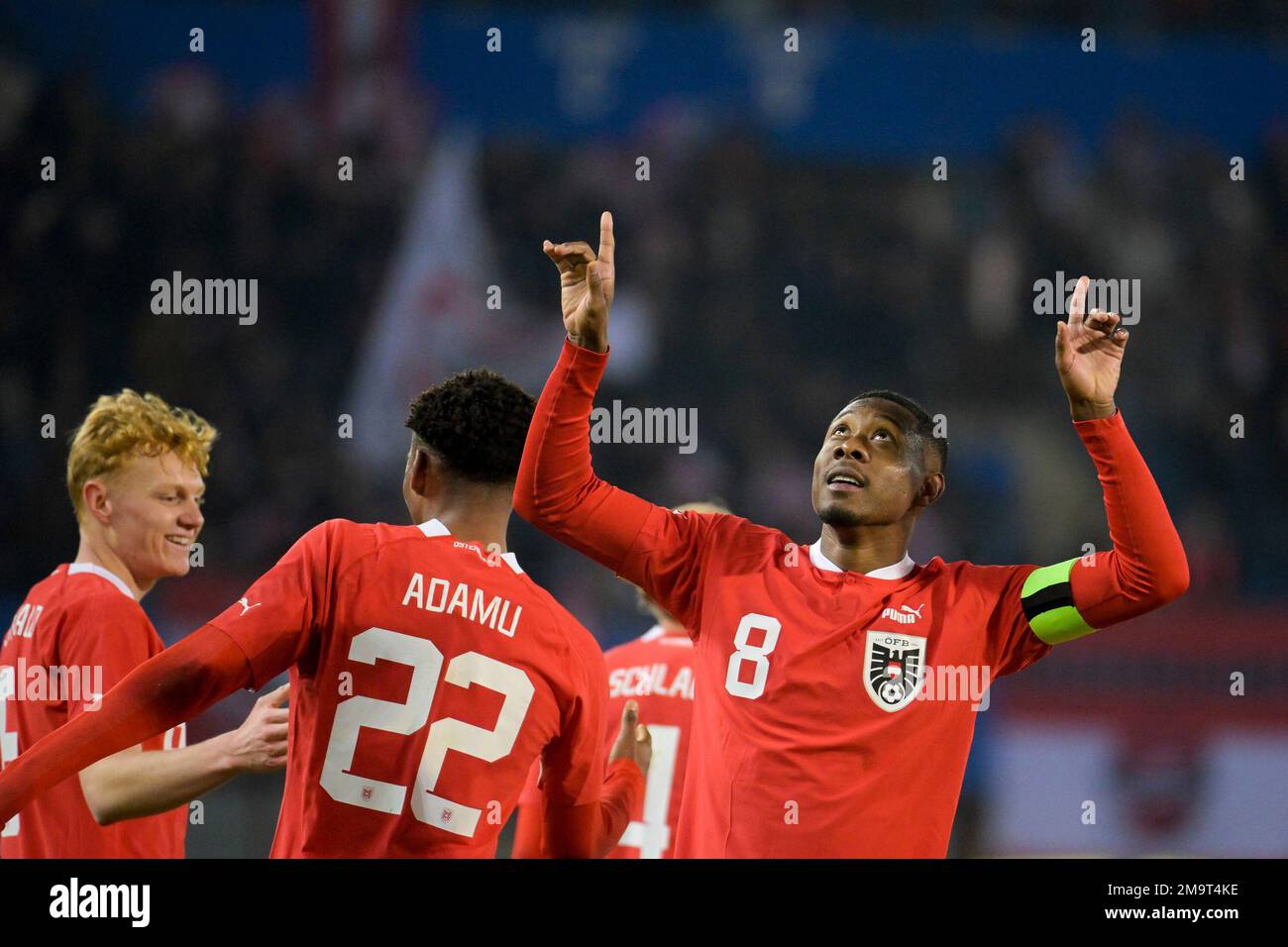 Austria's David Alaba, right, celebrates after scoring during the ...