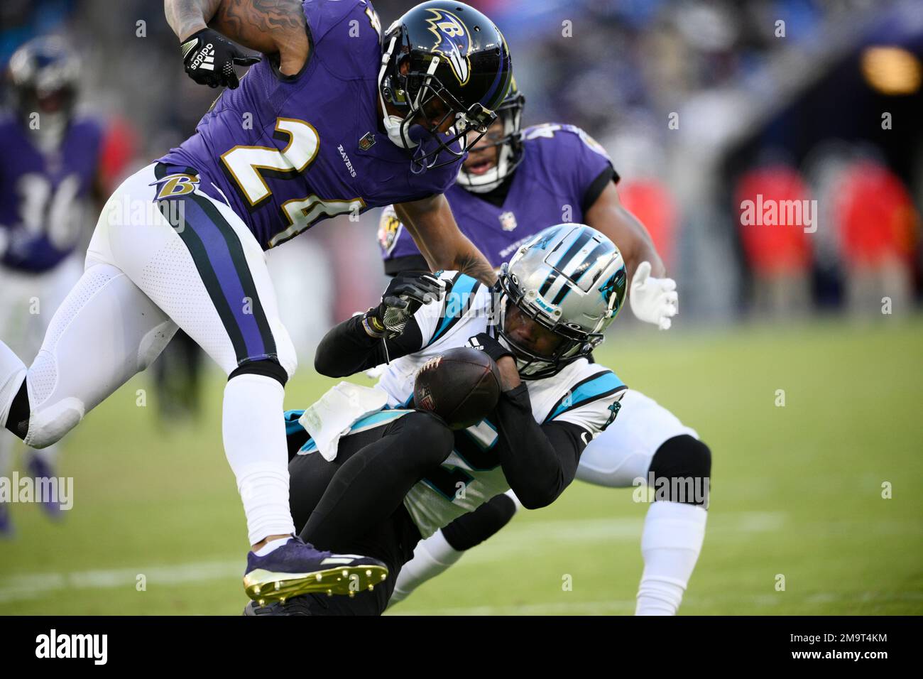 Baltimore Ravens cornerback Marcus Peters (24) strips the ball from ...