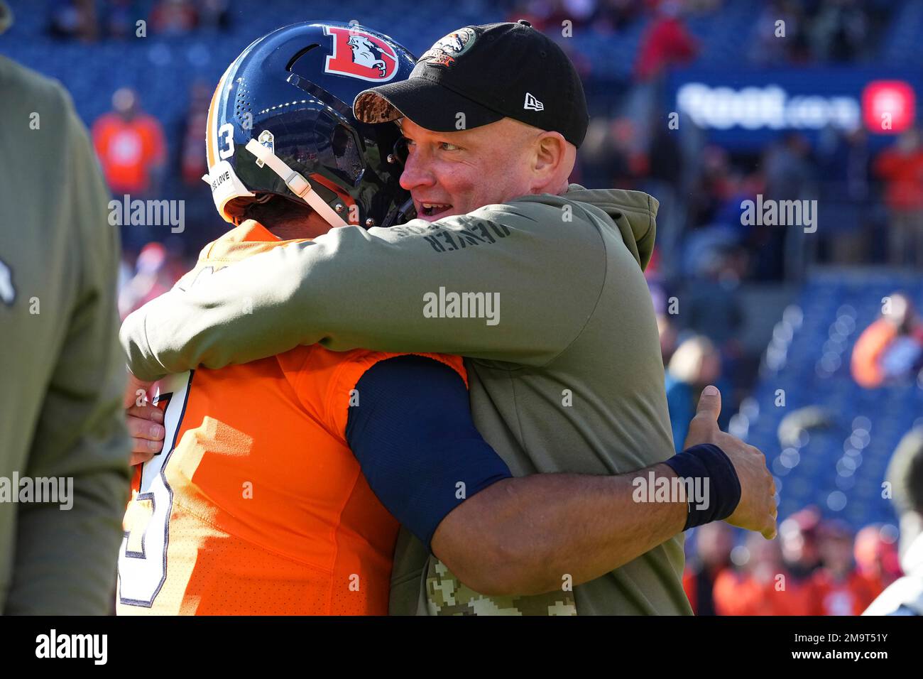 Denver Broncos quarterback Russell Wilson, left, hugs head coach ...