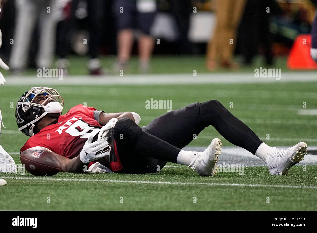 Atlanta Falcons tight end Kyle Pitts (8) lies on the turf after a hit ...