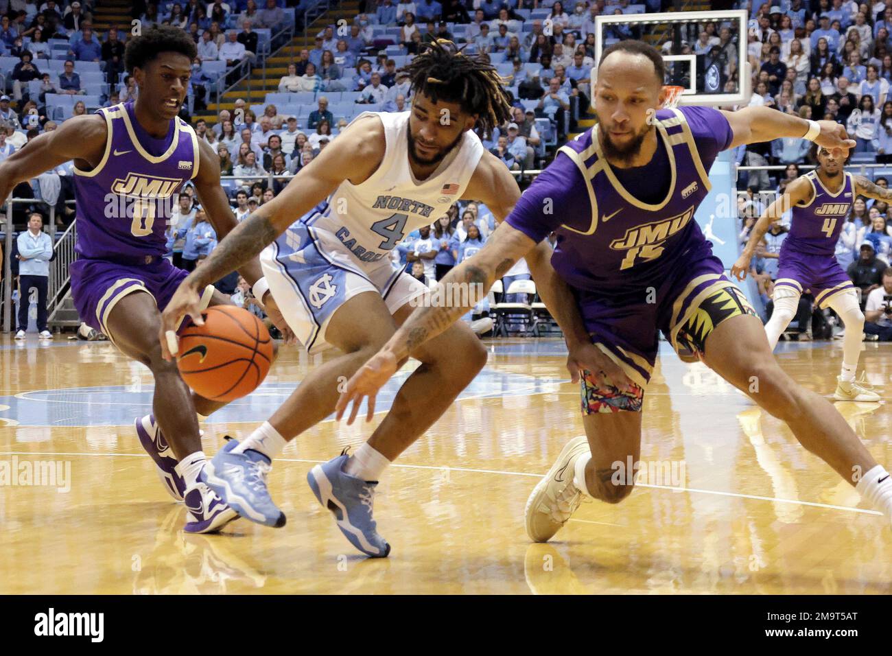 James Madison guard Xavier Brown (0) and guard Takal Molson pressure ...