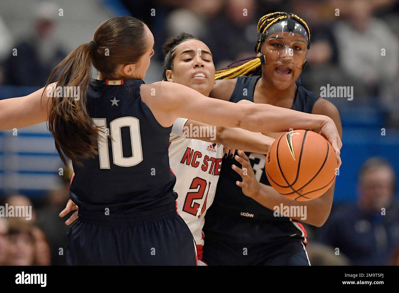 Connecticut's Nika Muhl (10) knocks the ball from NC State's Madison ...